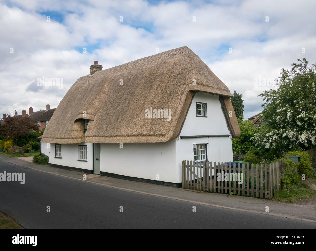 Street view of an old thatched cottage in the pretty village of Foxton ...