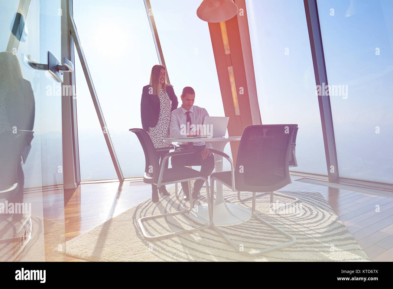 Businesspeople using laptop at conference table Stock Photo - Alamy Businesspeople using laptop at conference table Stock Photo - Alamy