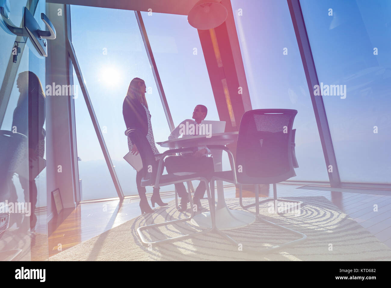 Businesspeople using laptop at conference table Stock Photo - Alamy Businesspeople using laptop at conference table Stock Photo - Alamy