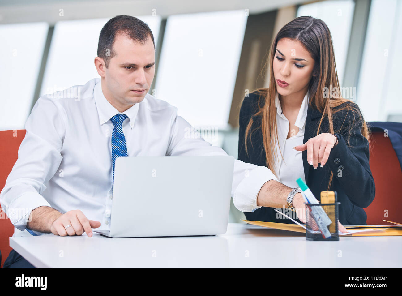Businesspeople using laptop at conference table Stock Photo - Alamy Businesspeople using laptop at conference table Stock Photo - Alamy