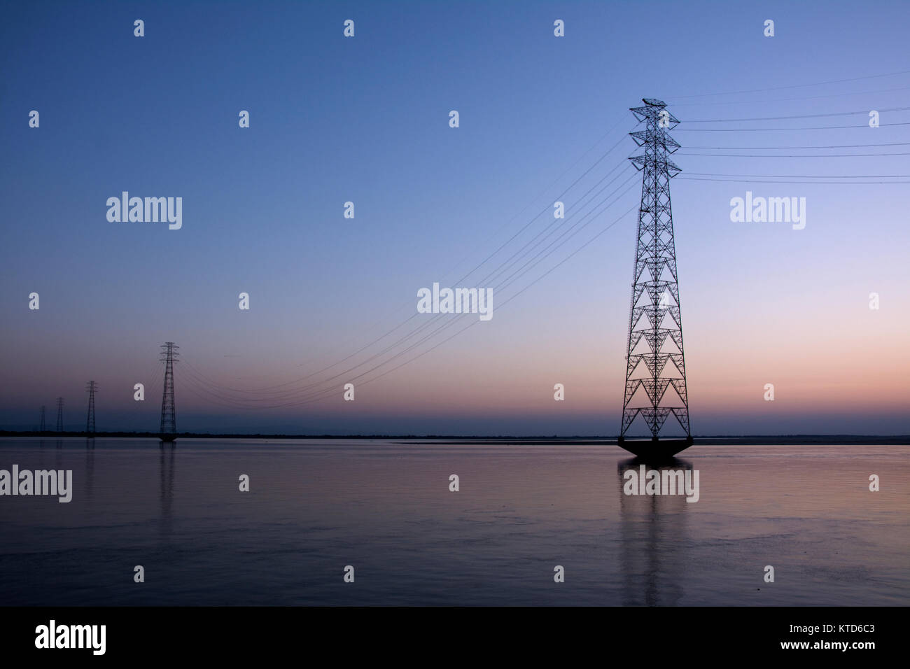 ASIA, India, Assam, Brahmaputra River, pylons on river at dusk Stock ...