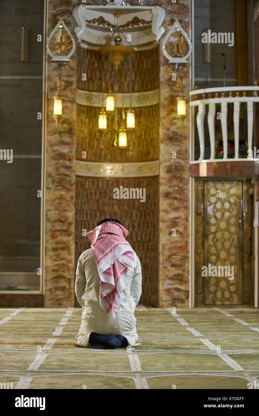 Religious muslim man praying inside the mosque Stock Photo - Alamy