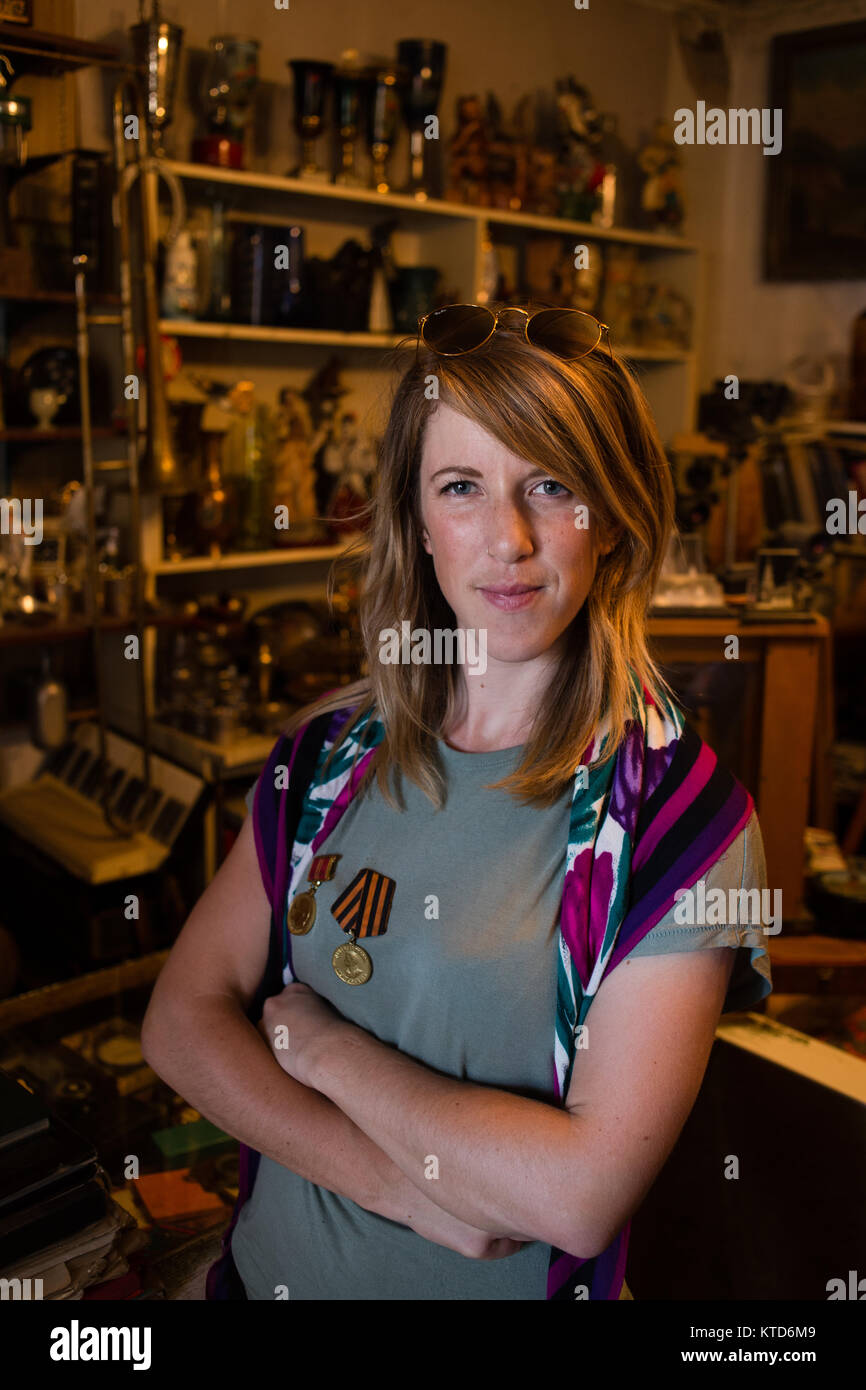 A female British tourist model shops for Soviet-era souvenirs in an ...