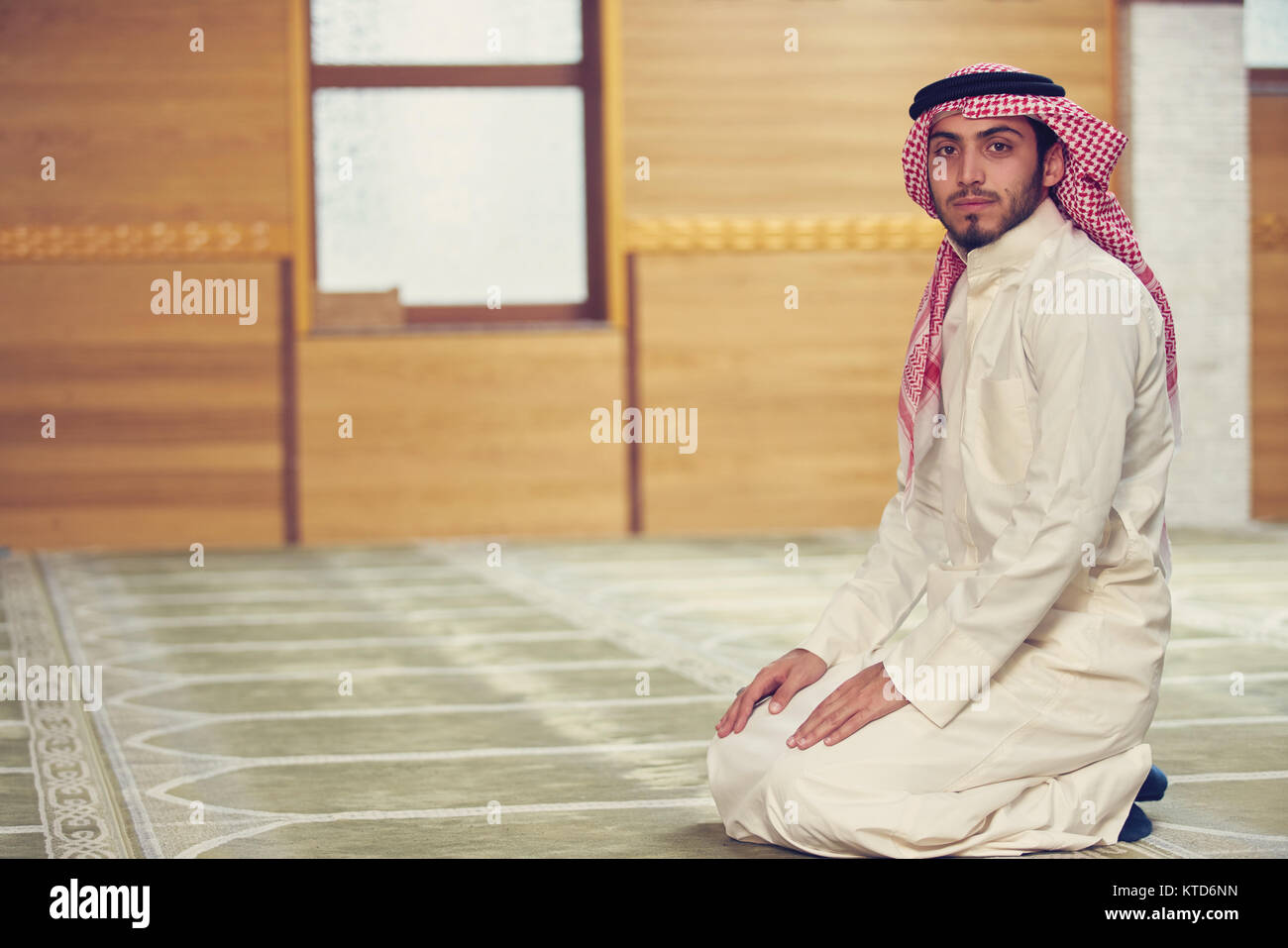 Religious muslim man praying inside the mosque Stock Photo - Alamy