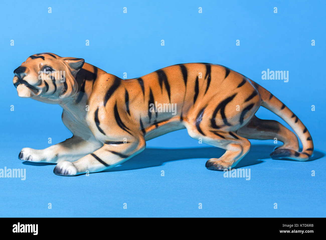 Ornamental china tiger on blue background Stock Photo - Alamy
