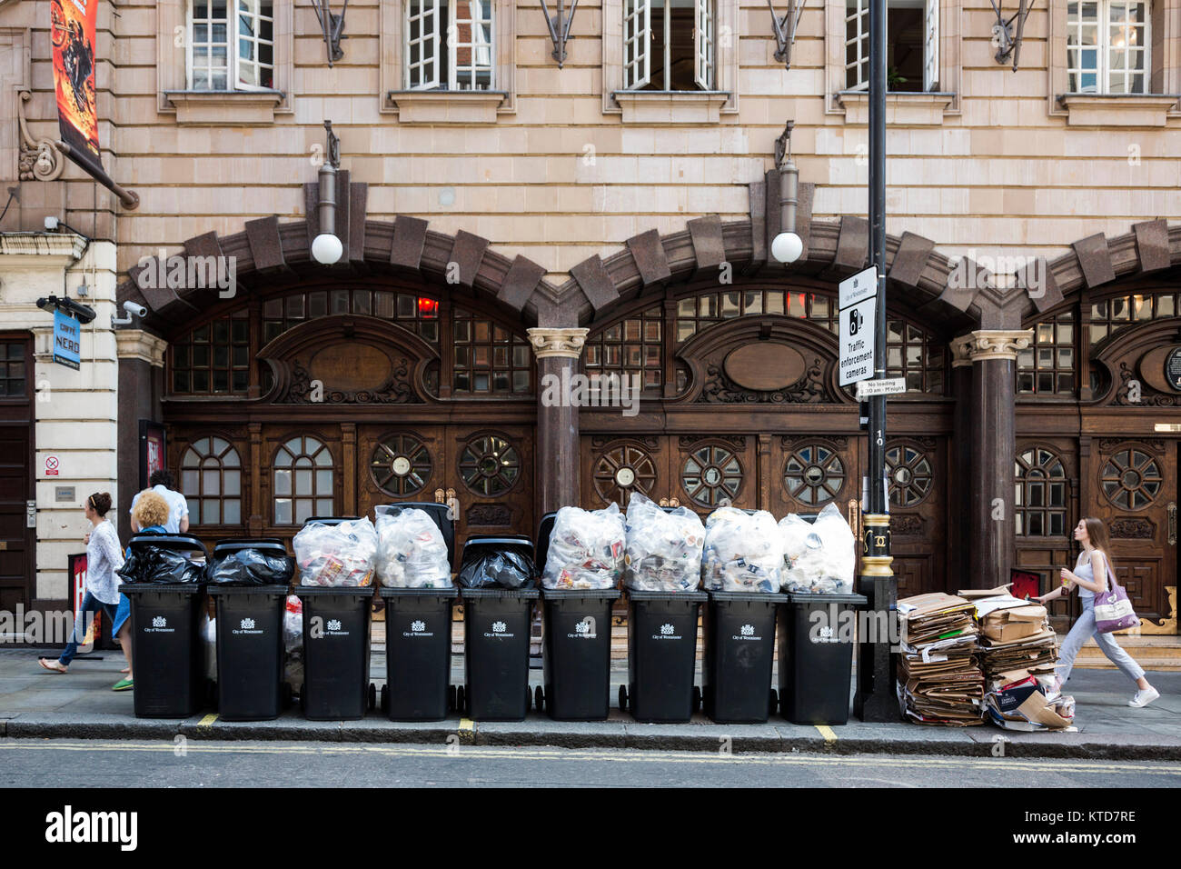 Rubbish bags towering in rubbish bins outside the London Coliseum ...