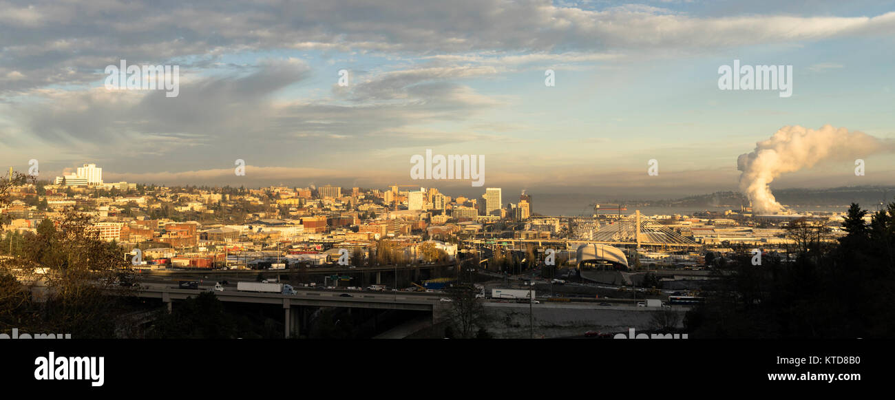 Winter blue sky appears at sunrise viewed from a hill in Tacoma ...