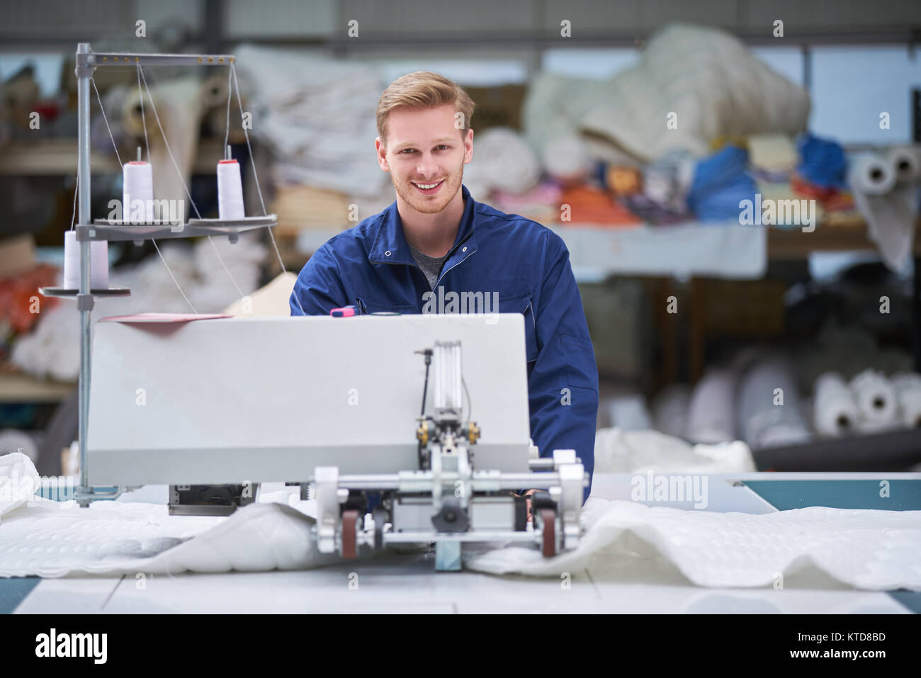 worker in protective clothing in factory using machine Stock Photo - Alamy