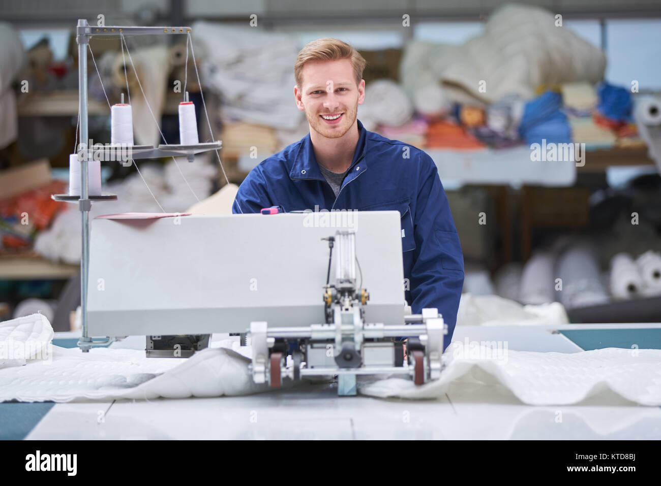 worker in protective clothing in factory using machine Stock Photo - Alamy