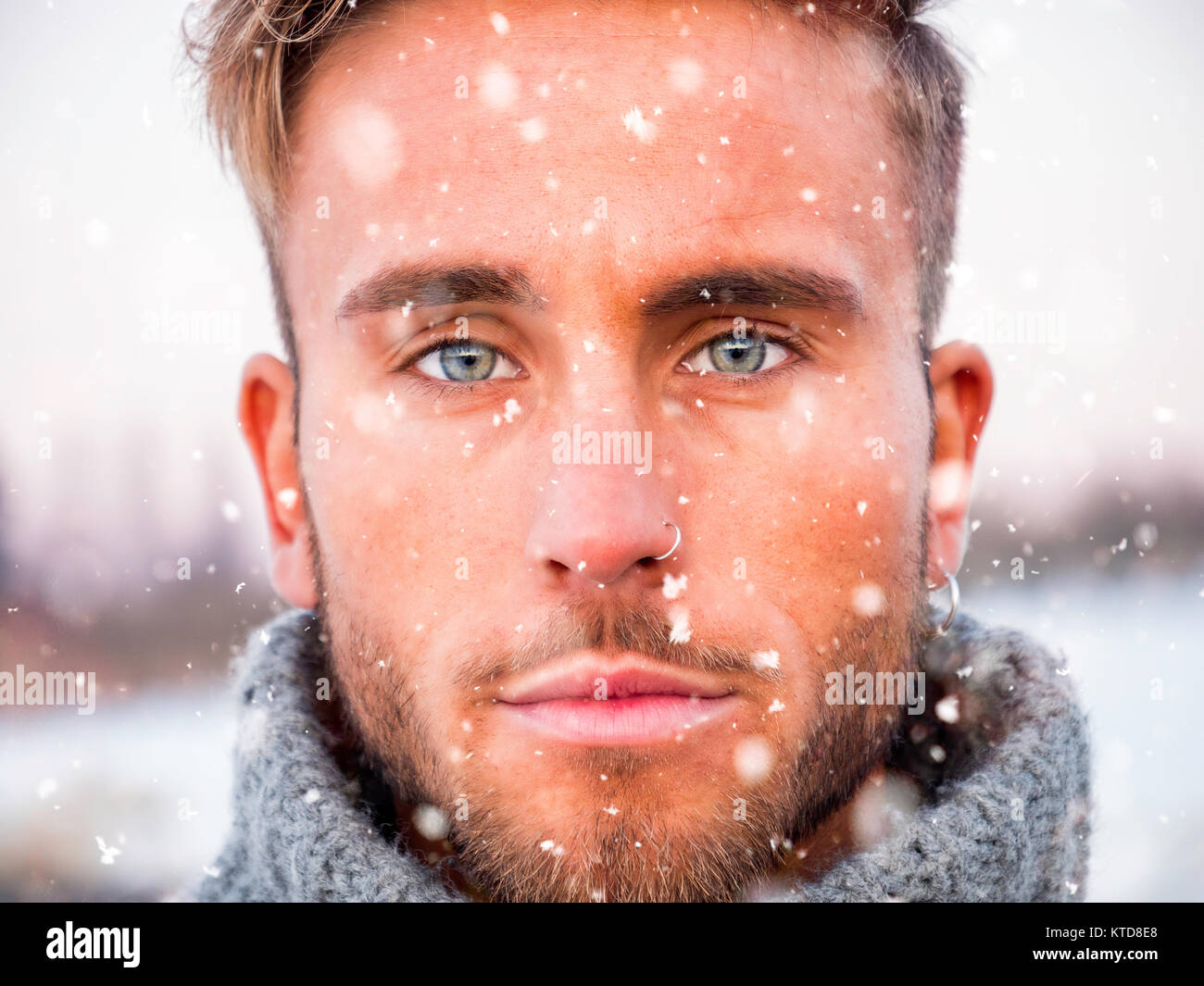 Headshot of handsome young man outdoor in winter fashion, wearing ...