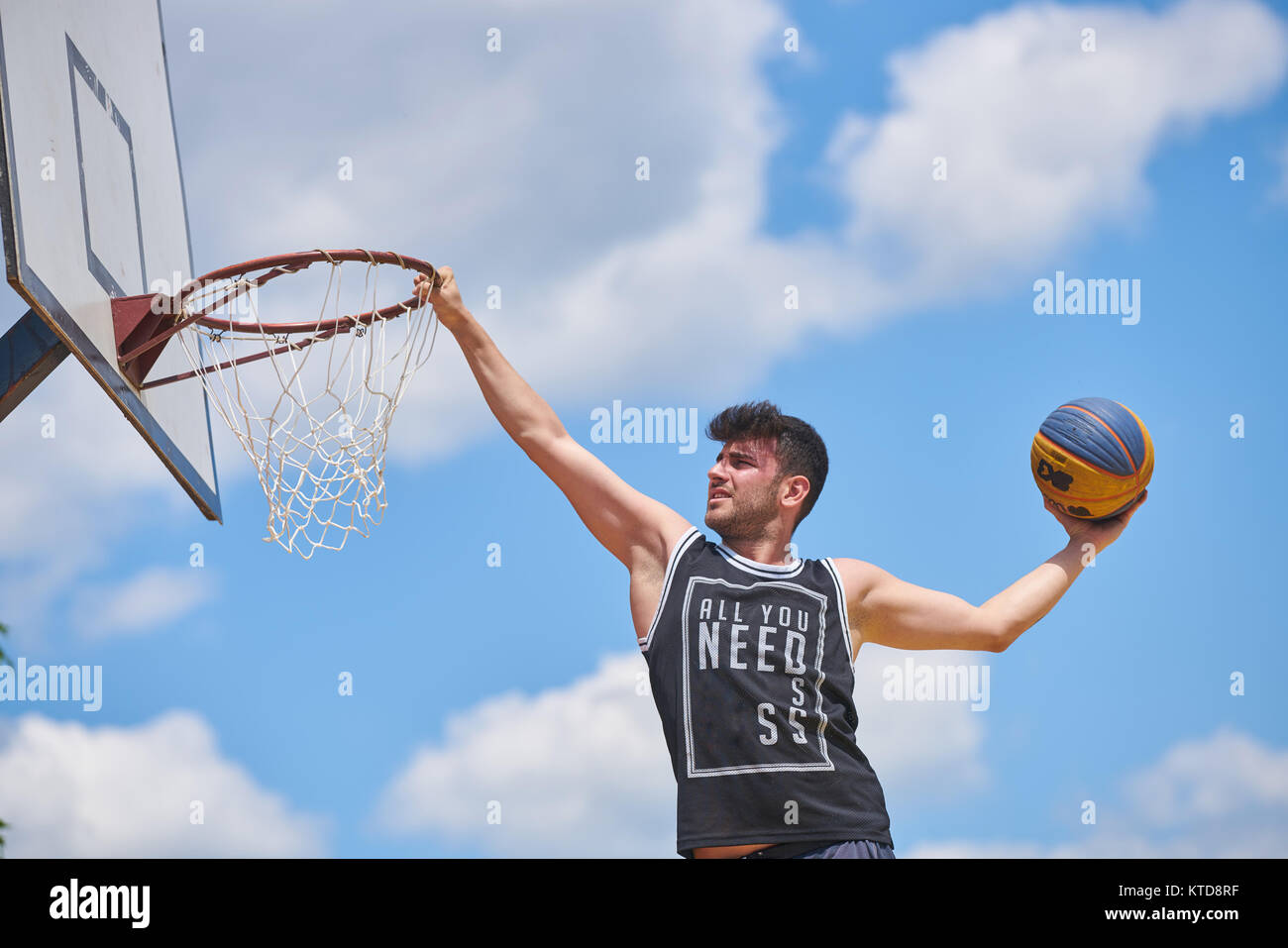 Basketball player in action flying high and scoring Stock Photo - Alamy