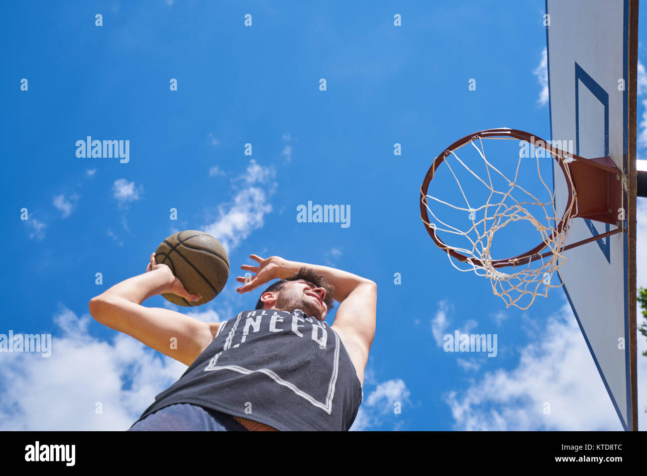 Basketball player in action flying high and scoring Stock Photo - Alamy