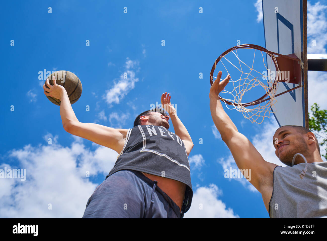 Basketball player in action flying high and scoring Stock Photo - Alamy