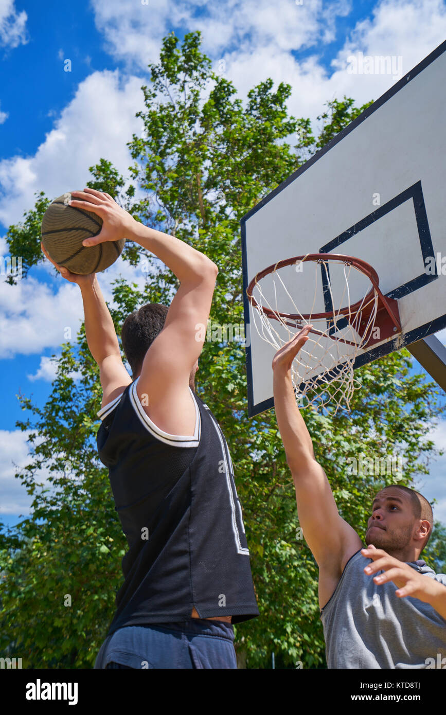 Basketball player in action flying high and scoring Stock Photo - Alamy