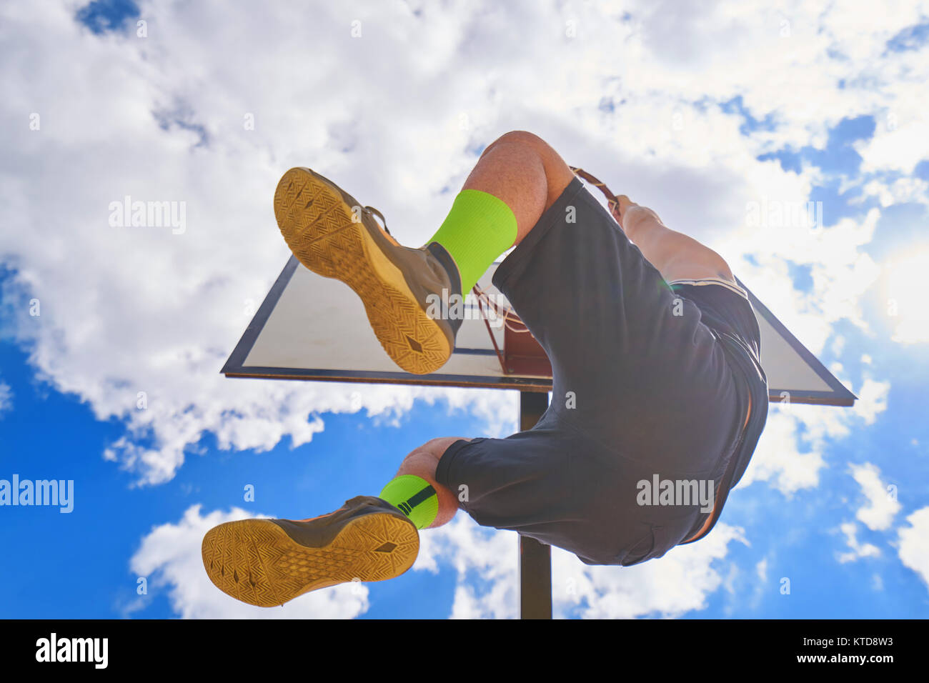 Basketball player in action flying high and scoring Stock Photo - Alamy