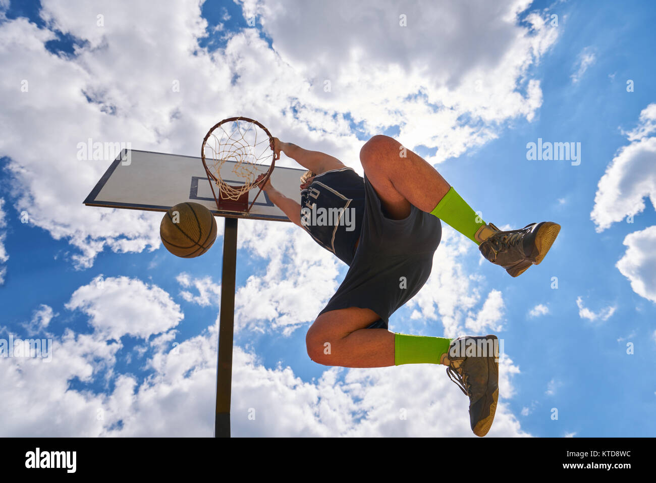 Basketball player in action flying high and scoring Stock Photo - Alamy