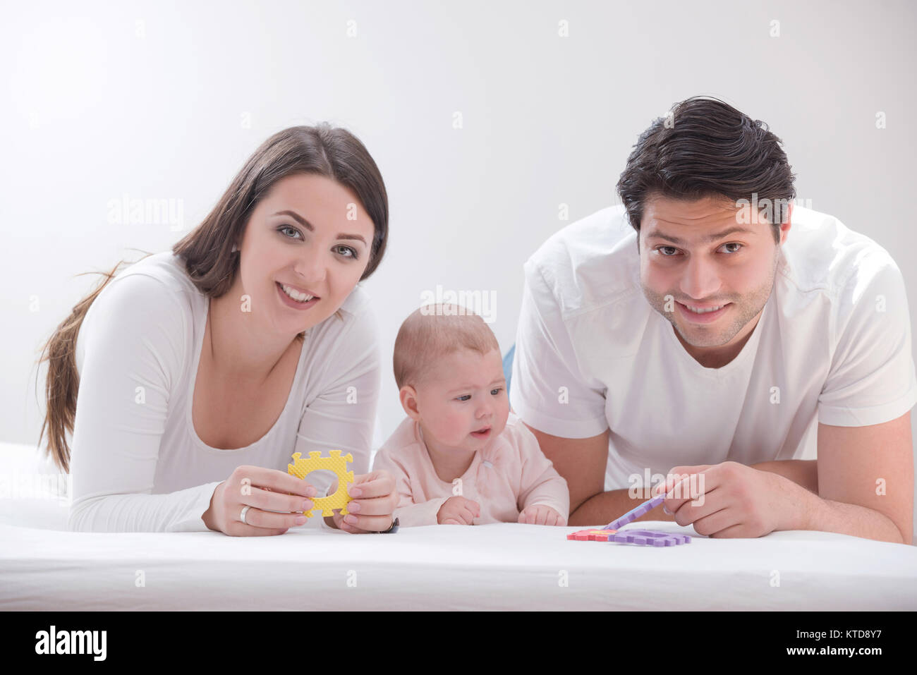 An image of a happy family of three Stock Photo - Alamy