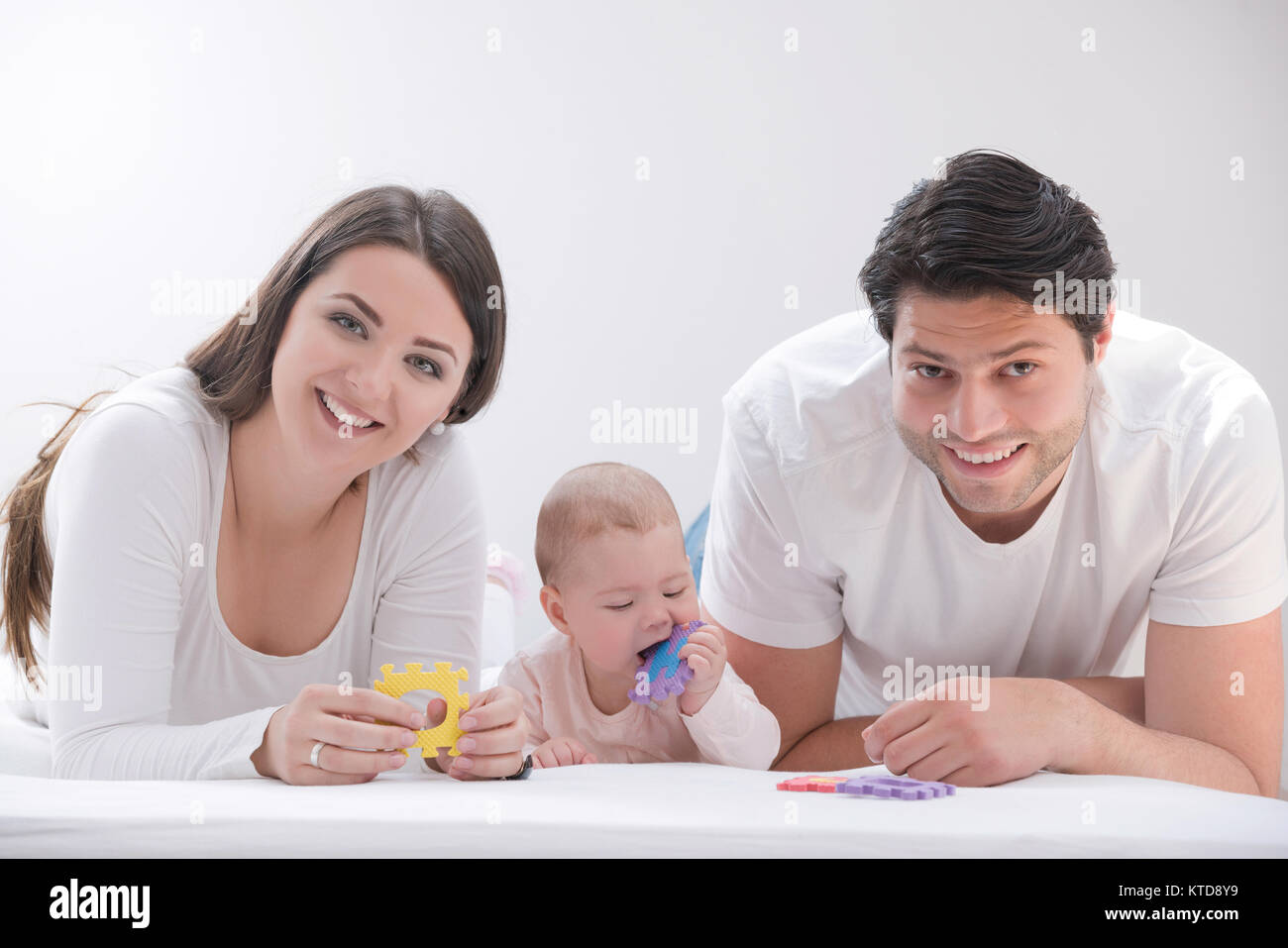 An image of a happy family of three Stock Photo - Alamy