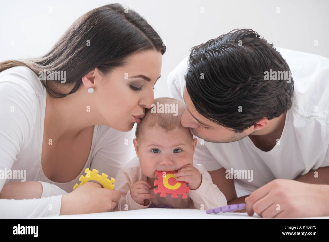 An image of a happy family of three Stock Photo - Alamy