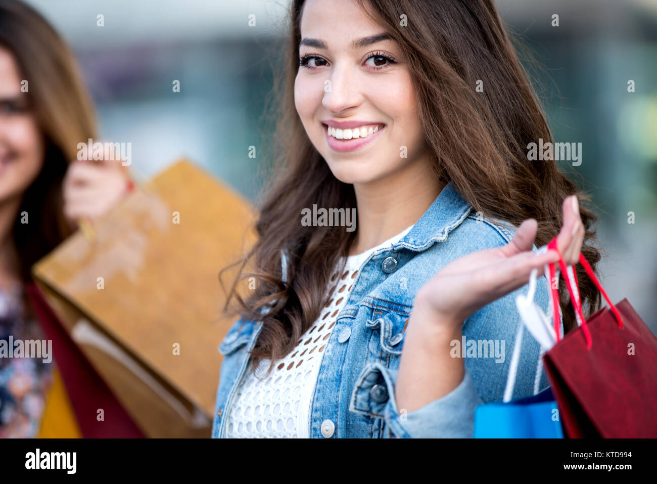 Happy girls shopping in late autumn. bags, walking, holidays Stock ...
