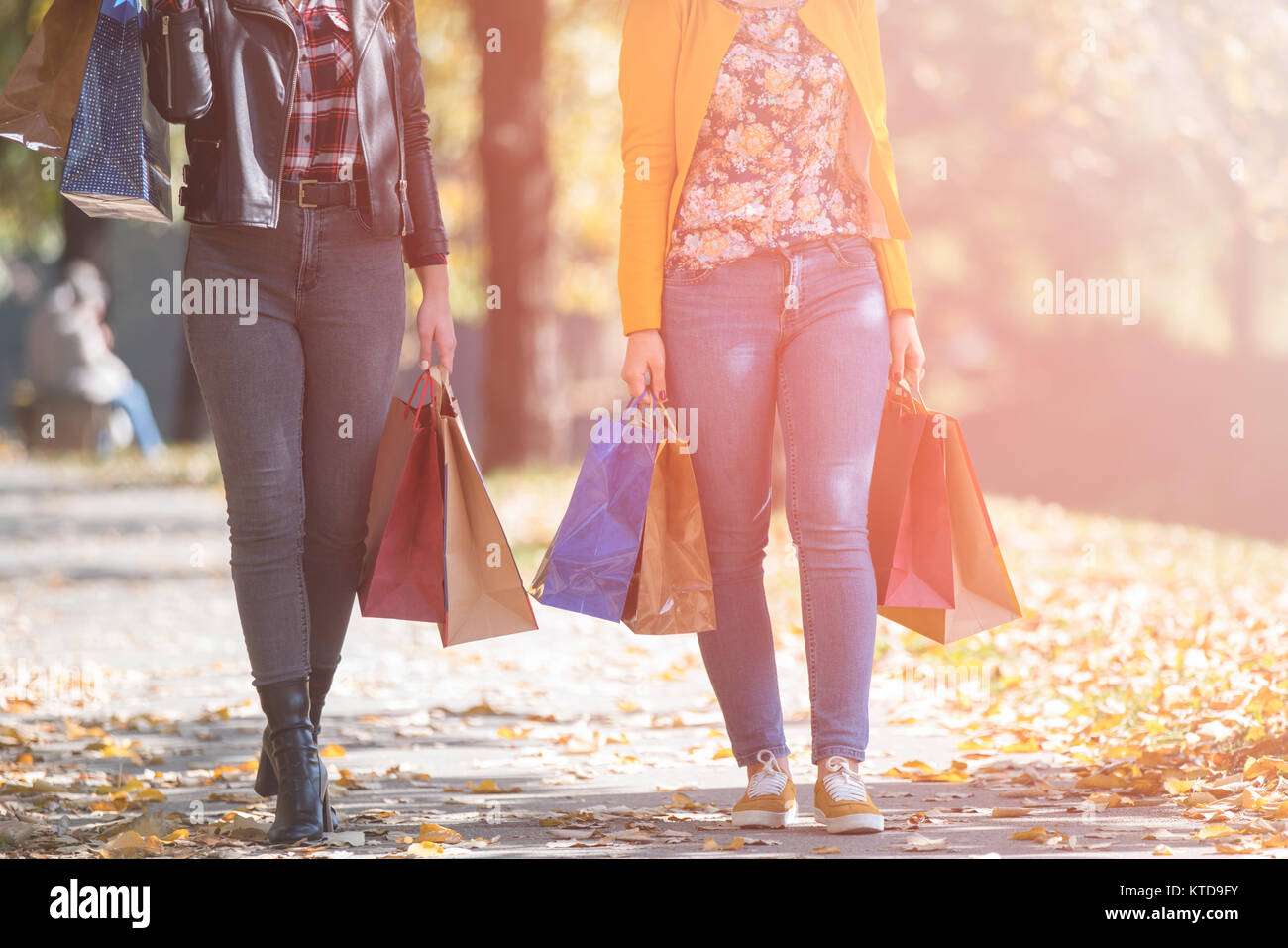 Happy girls shopping in late autumn. bags, walking, holidays Stock ...