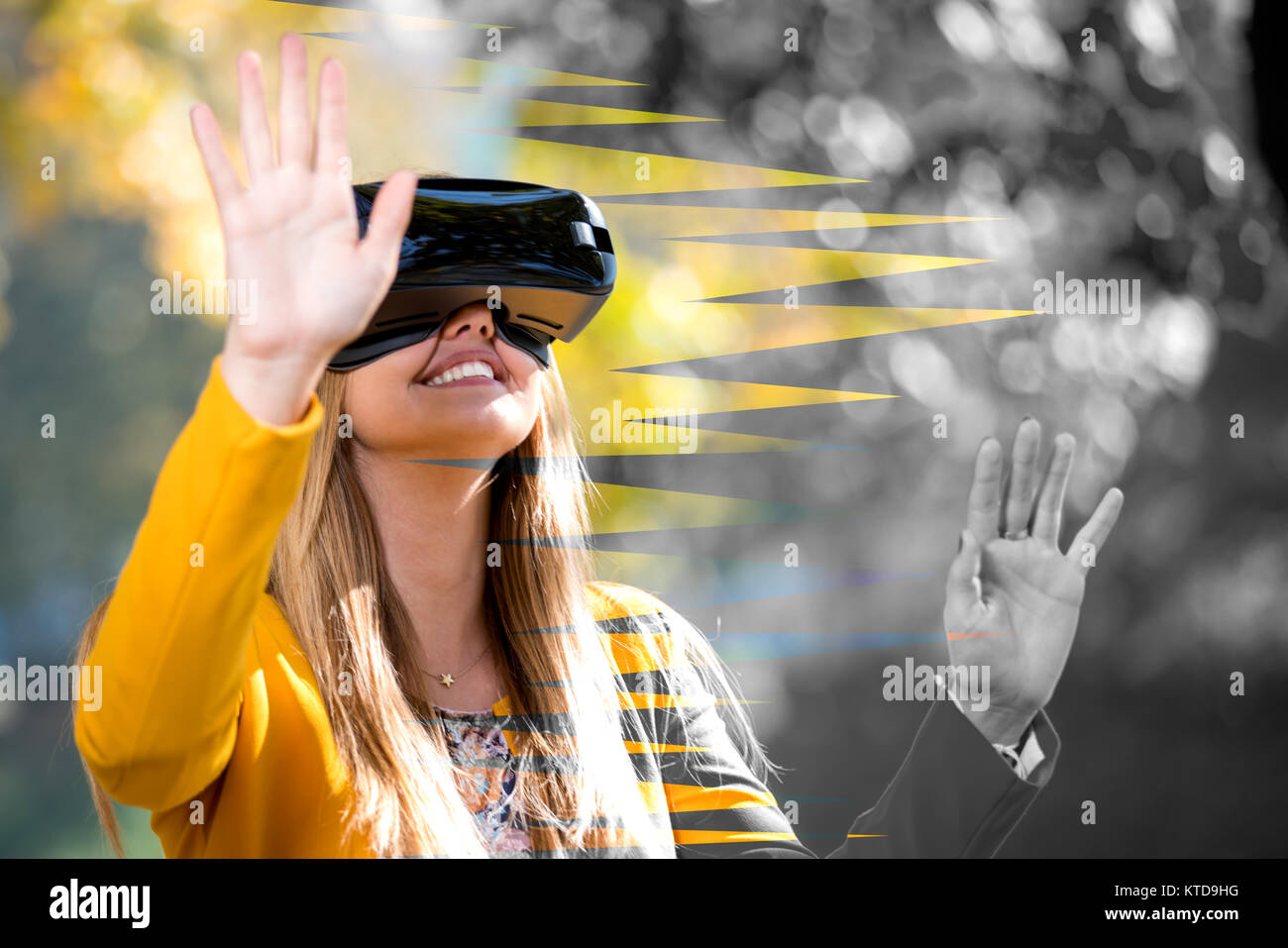 Pretty girl using VR headset outside in the park having fun Stock Photo ...