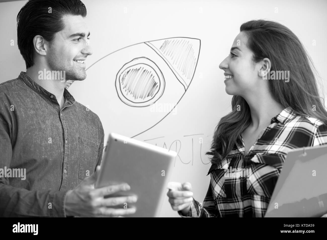 Young people comparing ideas at startup meeting board. concept Stock ...