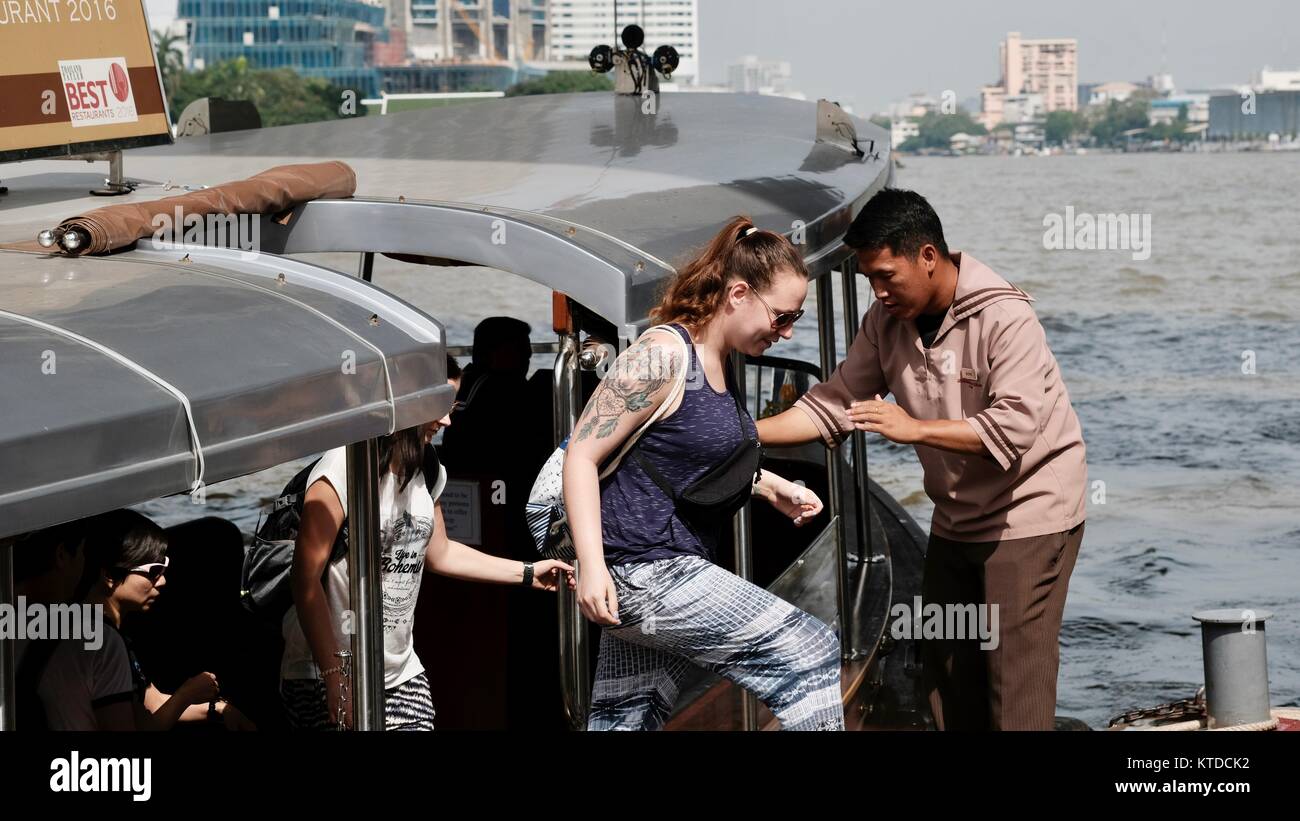 People getting Off and On The Boat at Sathorn Pier on the Chao Phraya ...
