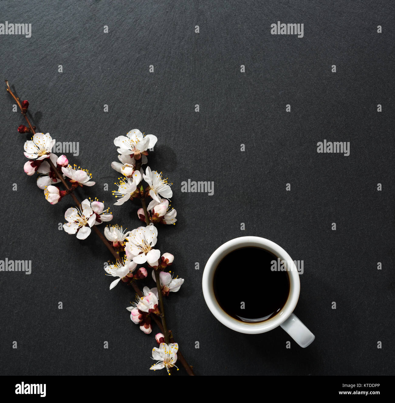 Cup of coffee and spring flowers on pink wooden table Stock Photo - Alamy