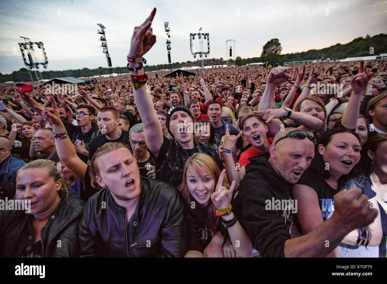 Energetic hard rock fans attend a live concert with the Danish hard ...