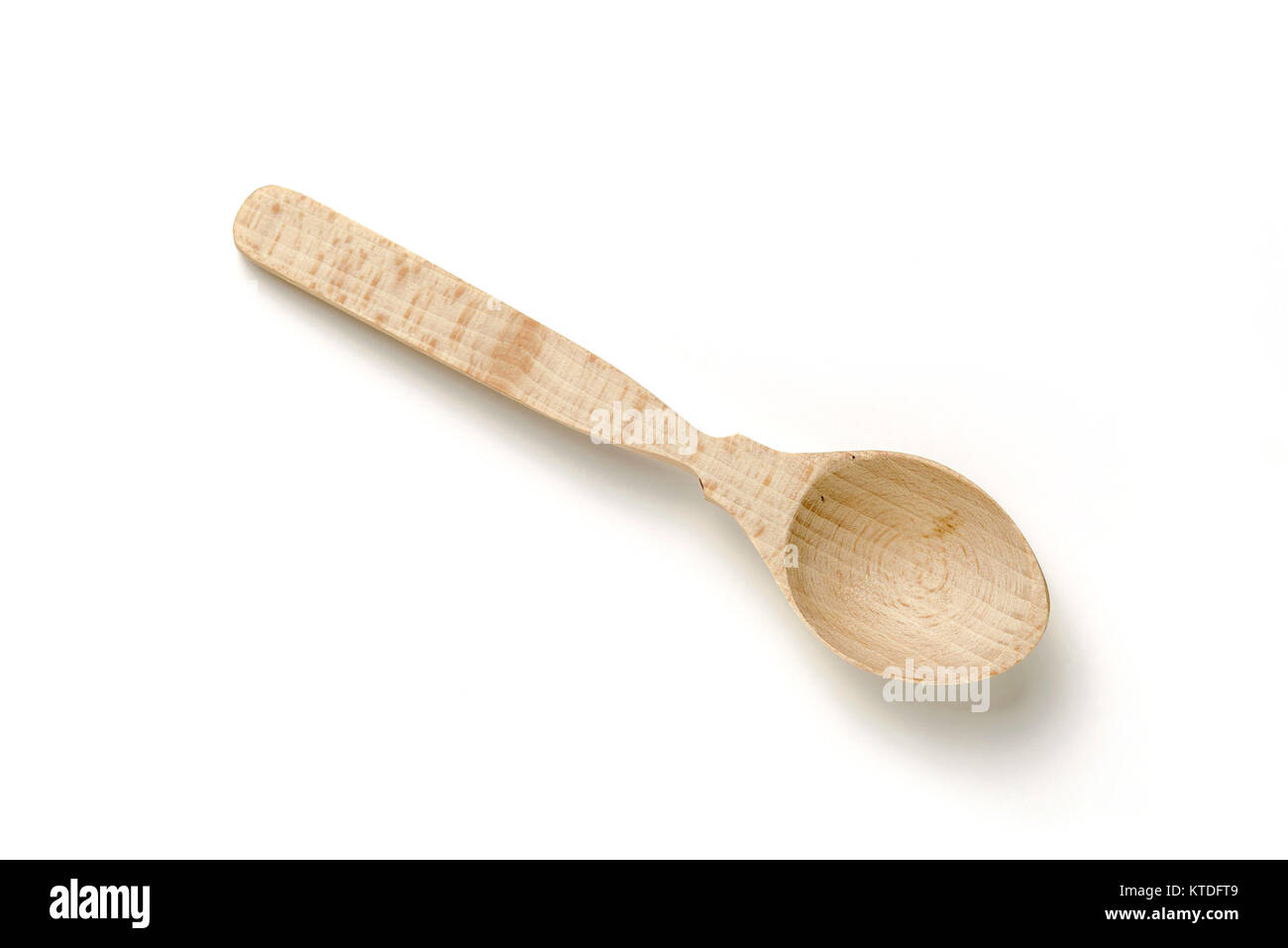 A little wooden spoon isolated on white background Stock Photo - Alamy