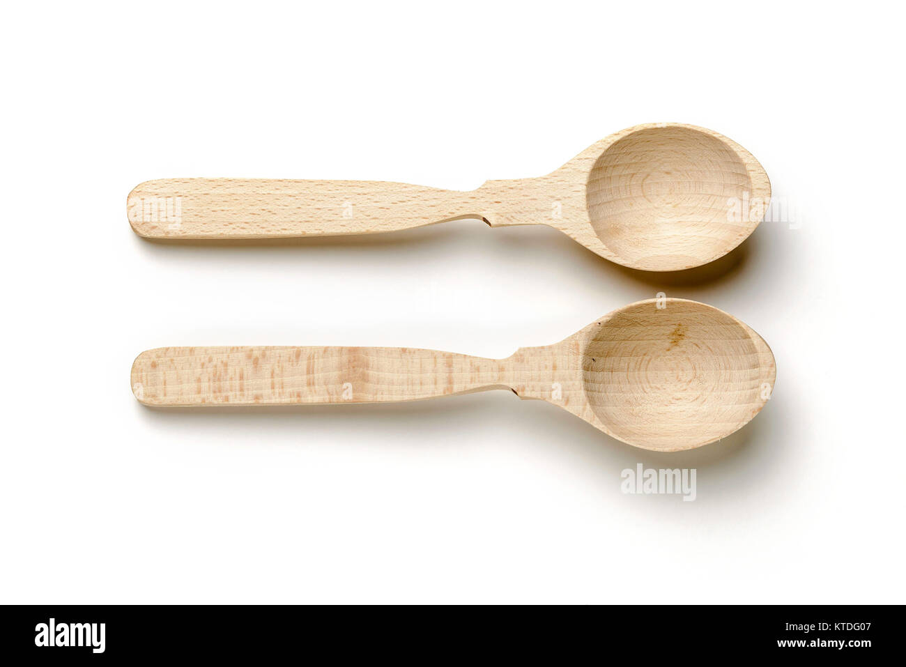 Two little wooden spoons isolated on white background Stock Photo - Alamy