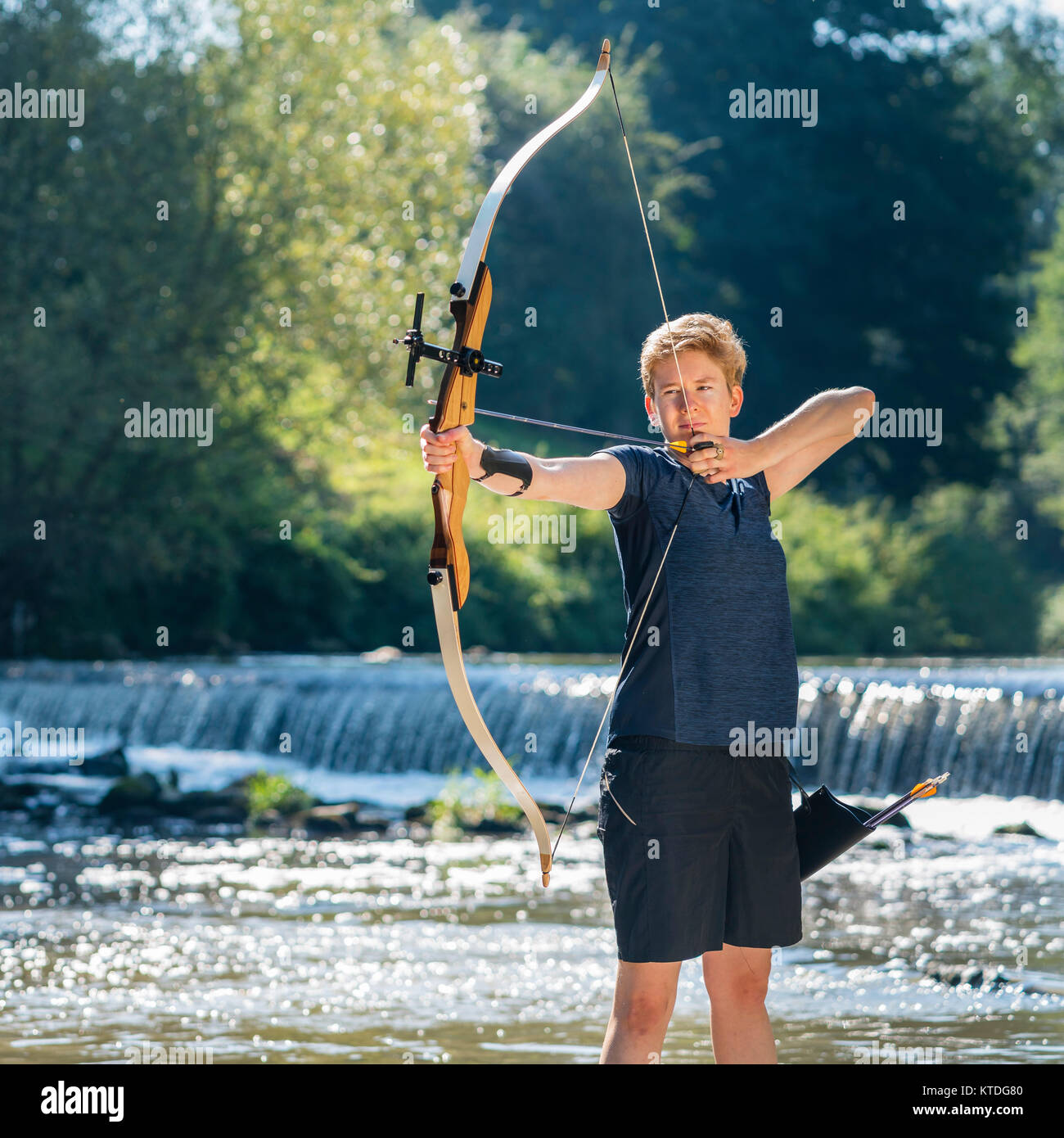 Portrait of archeress aiming with her bow Stock Photo - Alamy