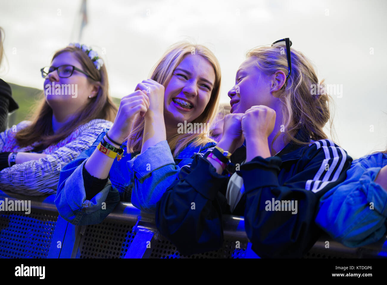 Two teenagers and music fans have a great concert with the Norwegian ...