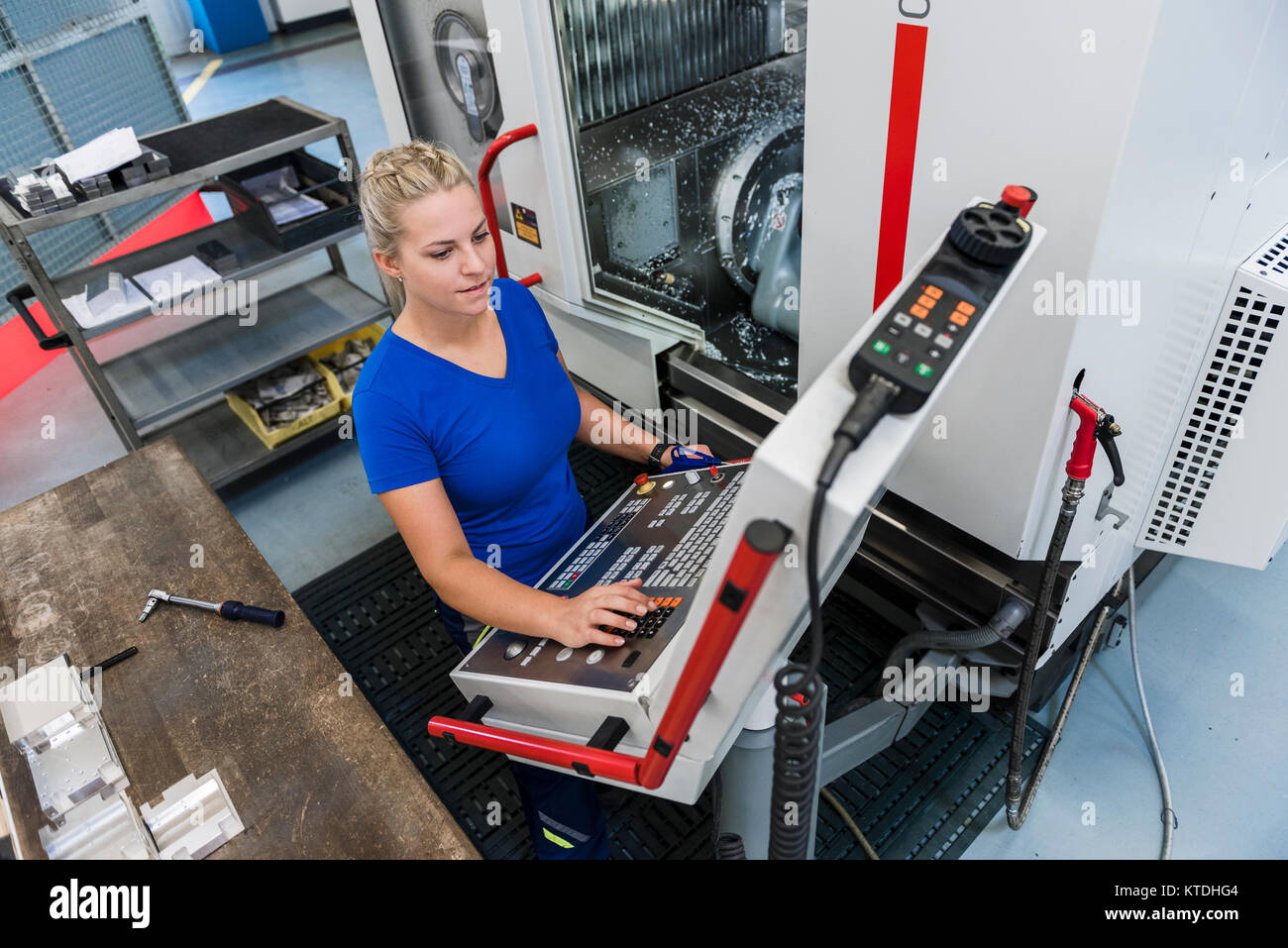 Woman operating control panel in industrial factory Stock Photo - Alamy