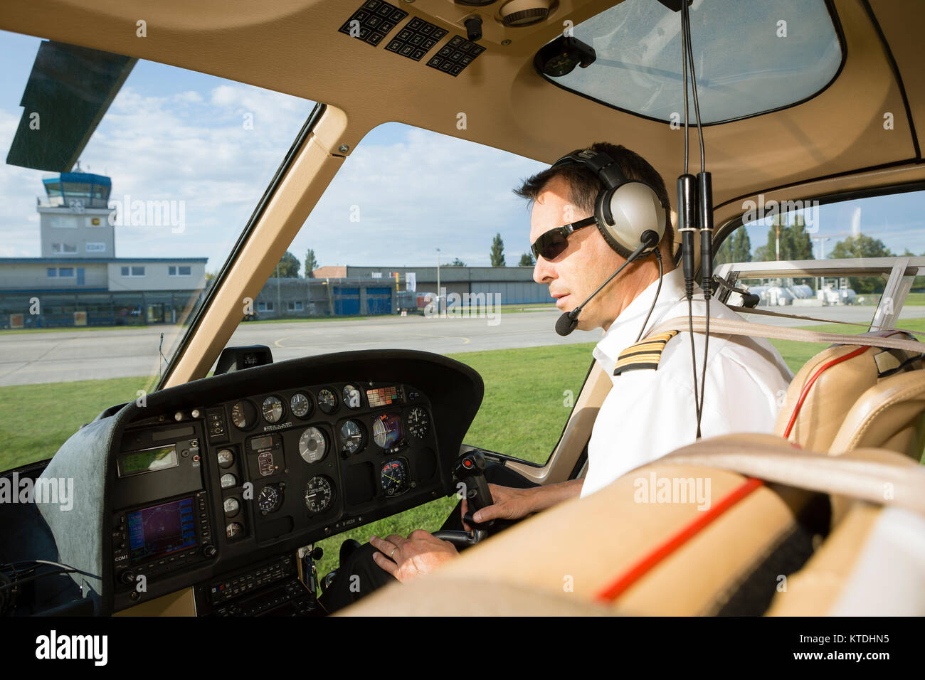 Portrait of pilot in cockpit of a helicopter Stock Photo - Alamy