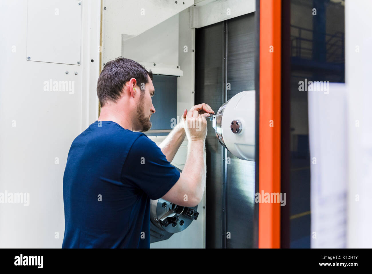 Man working at a machine Stock Photo - Alamy