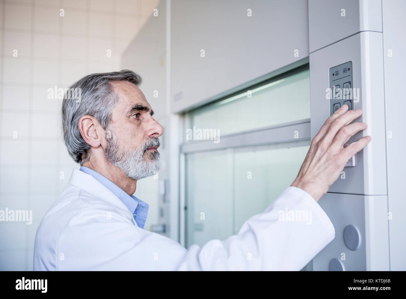 Scientist in lab handling security system Stock Photo - Alamy