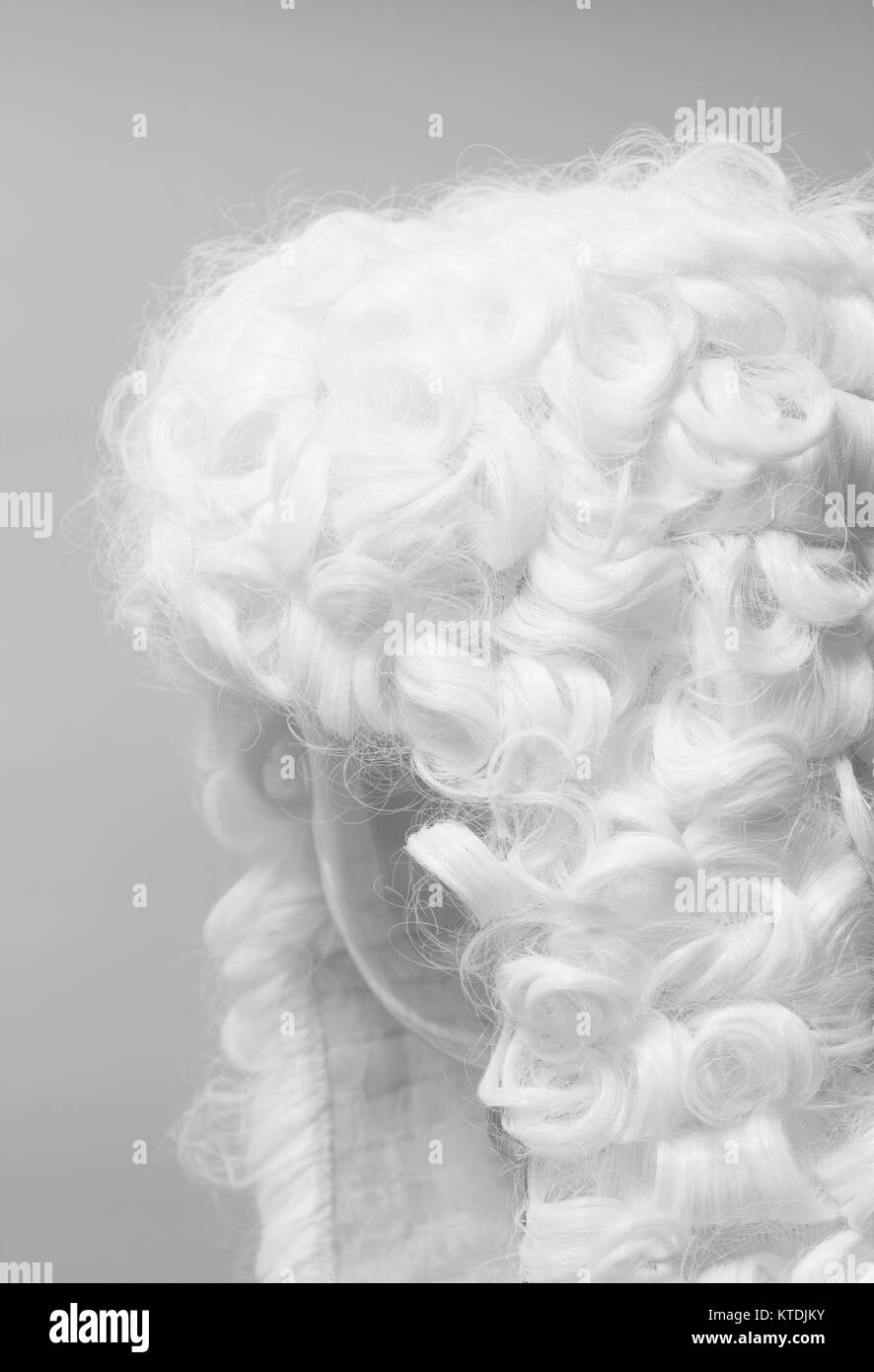 Judge wig on a gray background Stock Photo - Alamy
