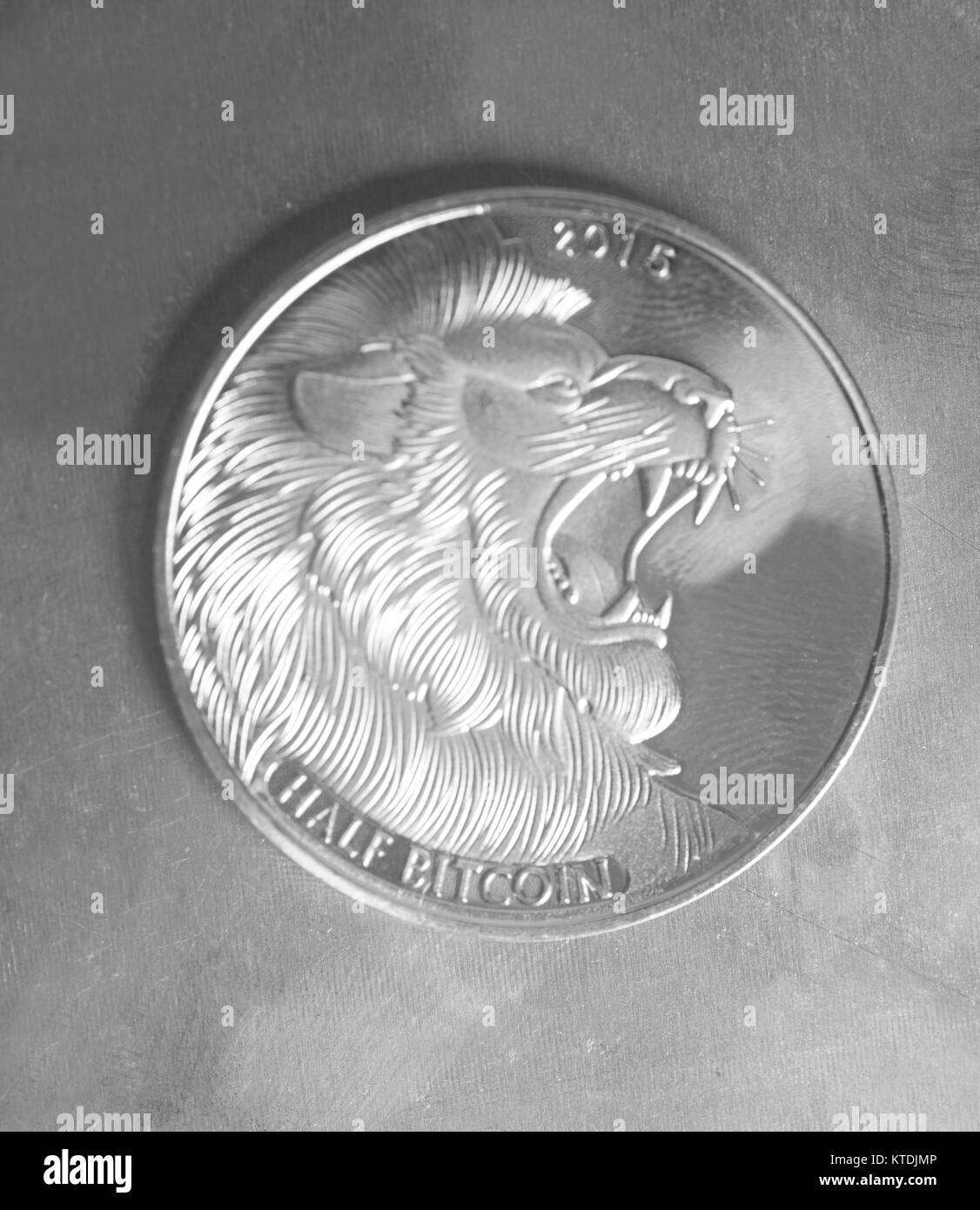 Half bitcoin with lion on on a silver background Stock Photo - Alamy