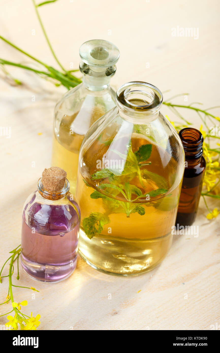 Bottles with tinctures or oil from medicinal herbs and wild flowers ...