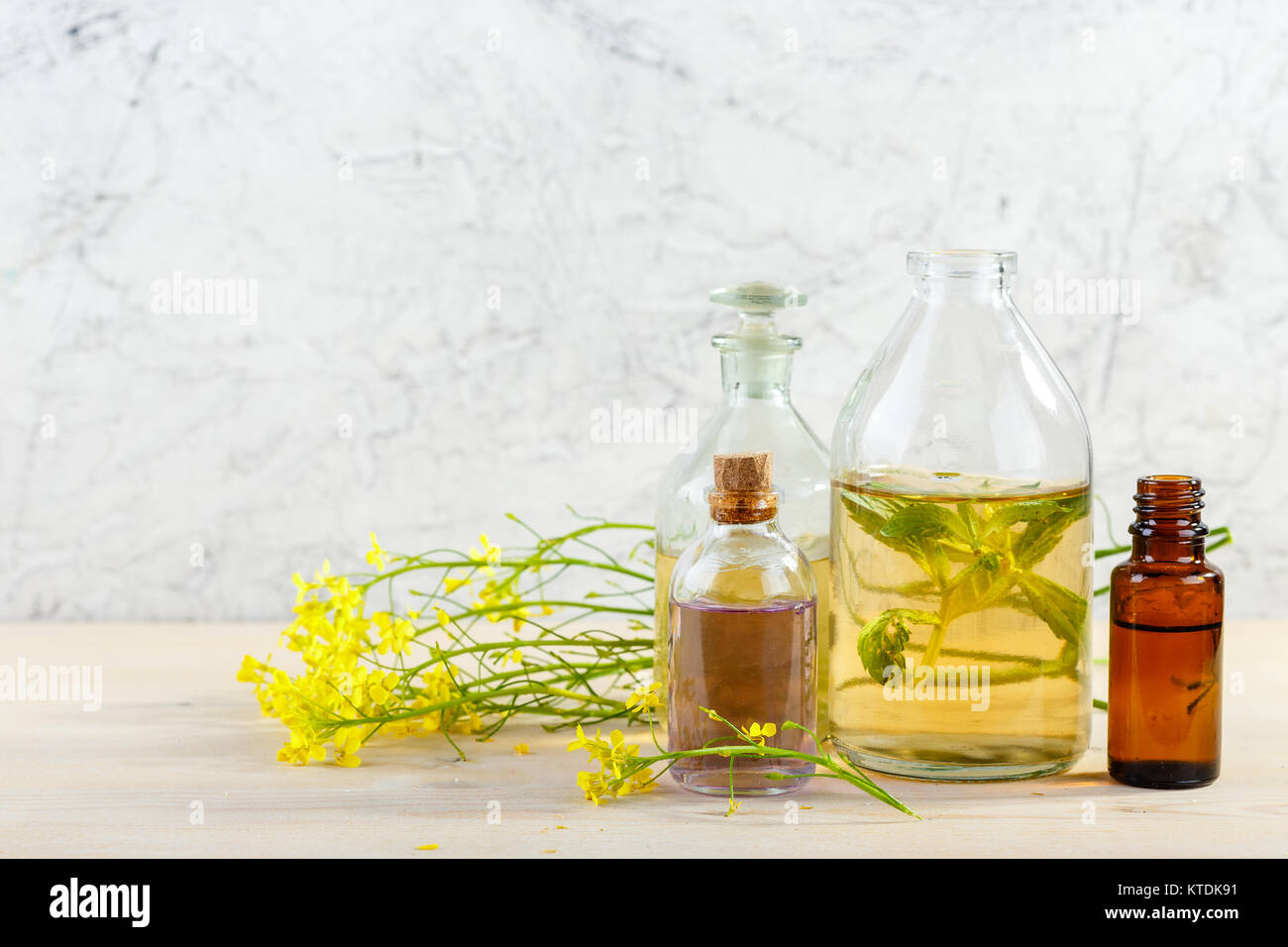 Bottles with tinctures or oil from medicinal herbs and wild flowers ...