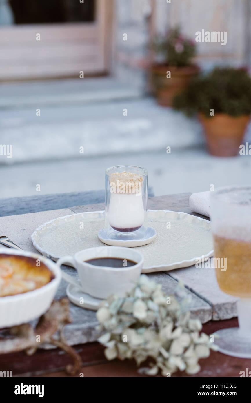 Italy, laid breakfast table on terrace Stock Photo - Alamy