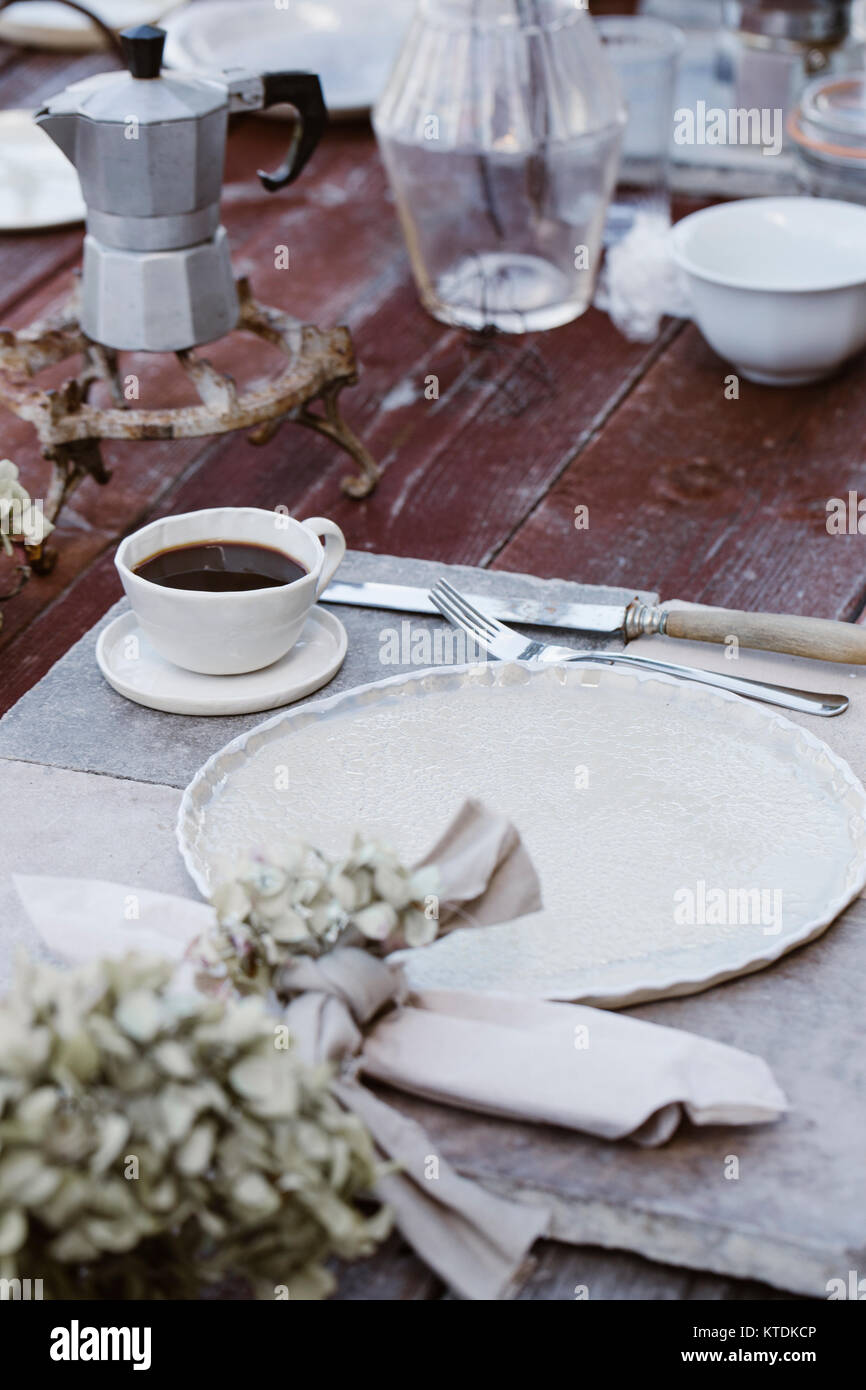 Italy, laid breakfast table on terrace Stock Photo - Alamy
