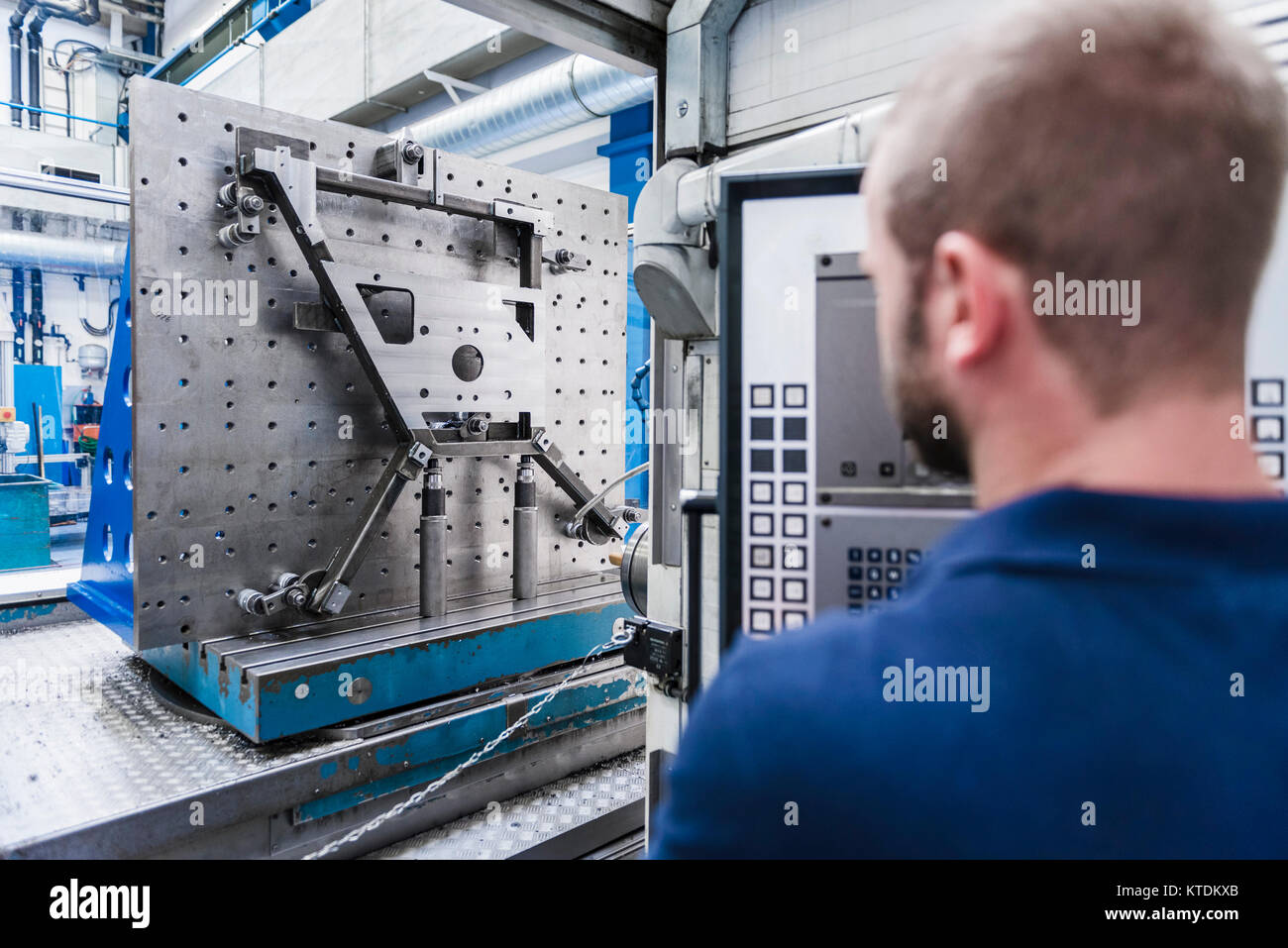 Man in industrial factory Stock Photo - Alamy