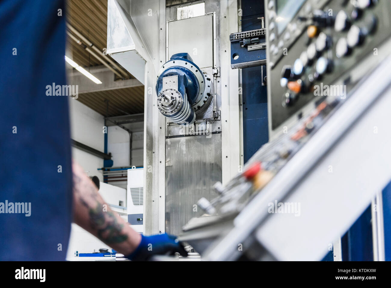 Close-up of man operating machine in industrial factory Stock Photo - Alamy