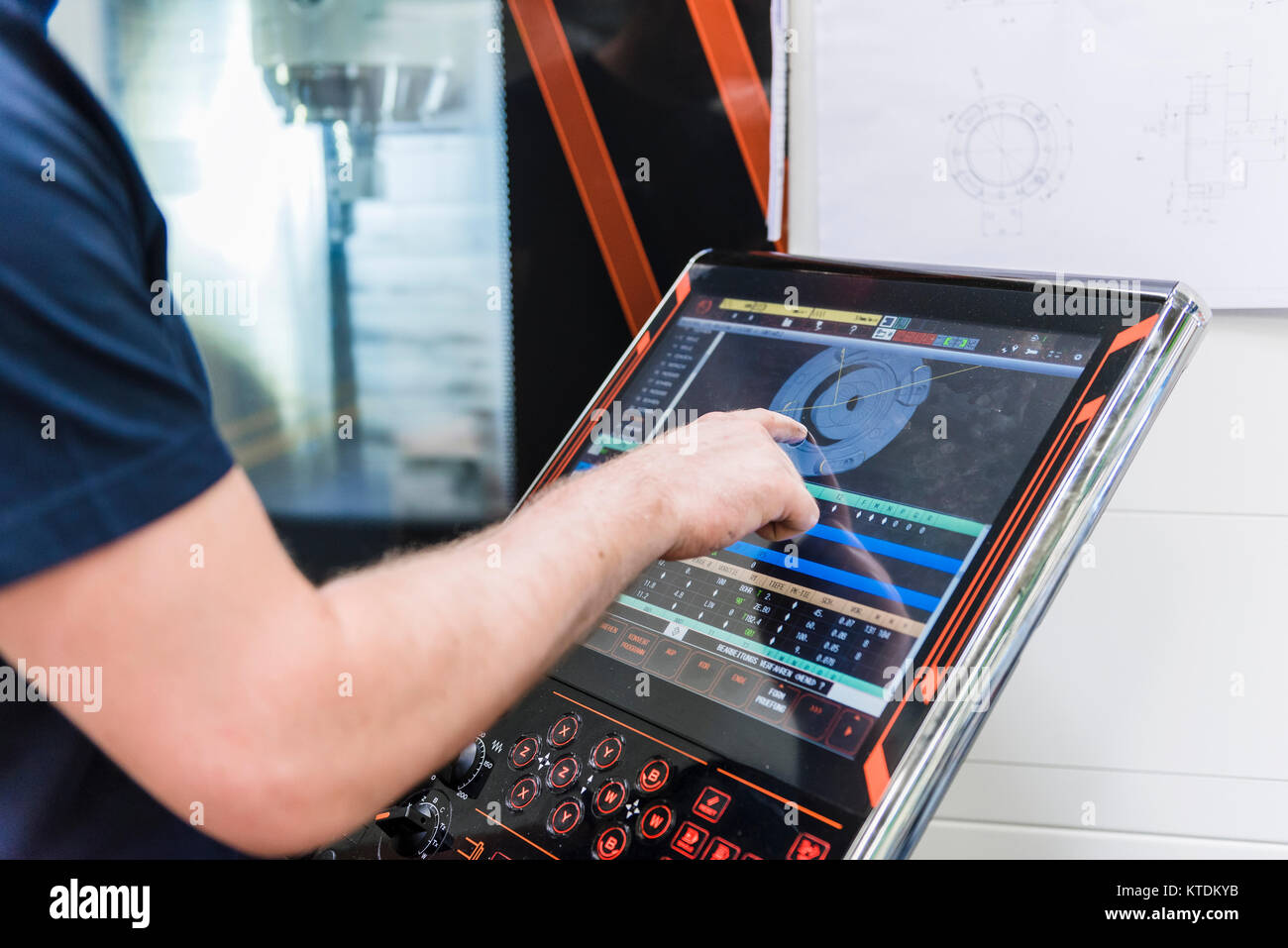 Close-up of man operating machine in industrial factory Stock Photo - Alamy