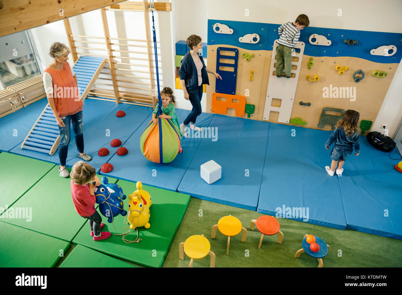 Pre-school teachers and children in gym room in kindergarten Stock ...