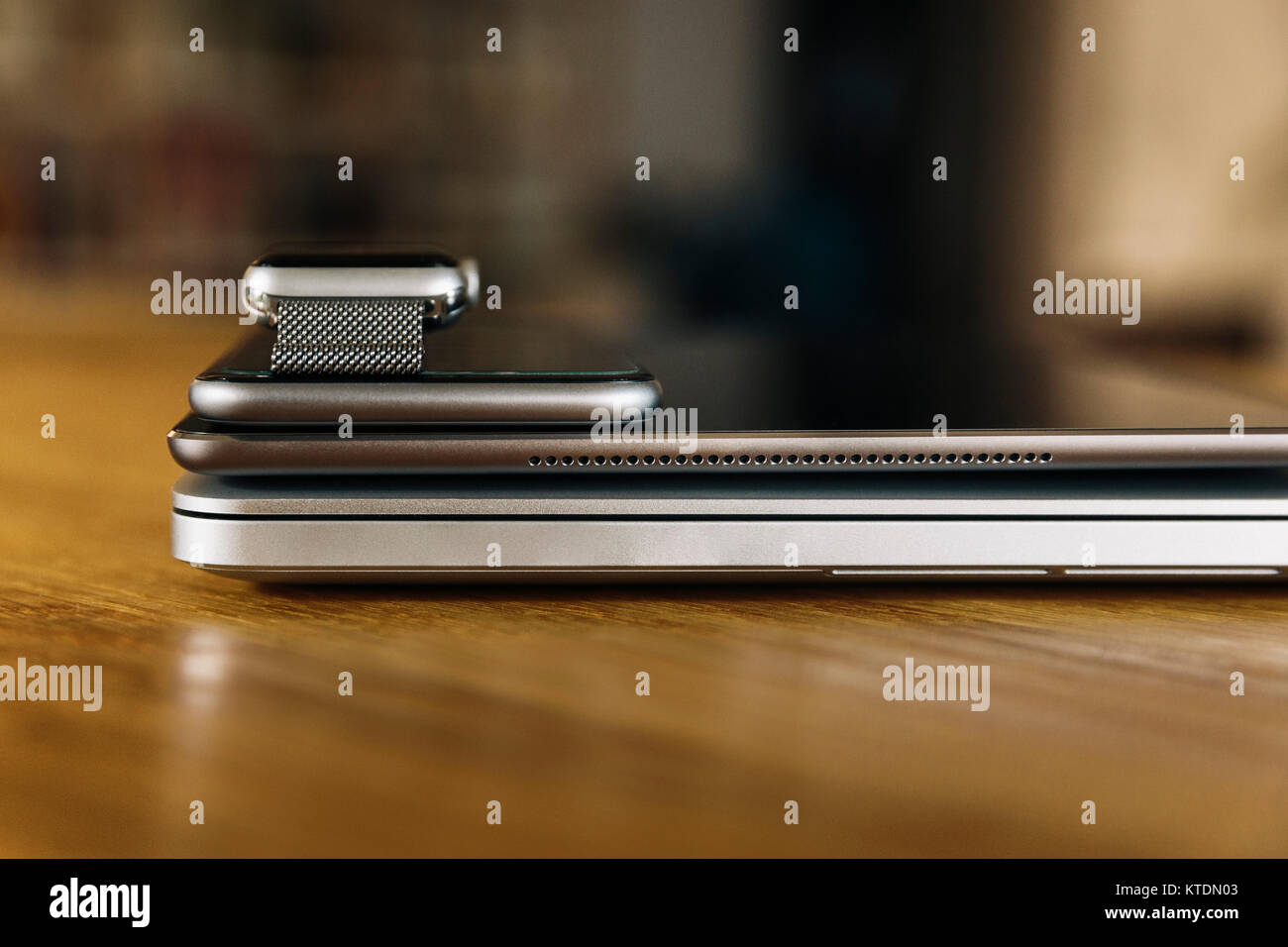 Stack of mobile devices on table top Stock Photo - Alamy