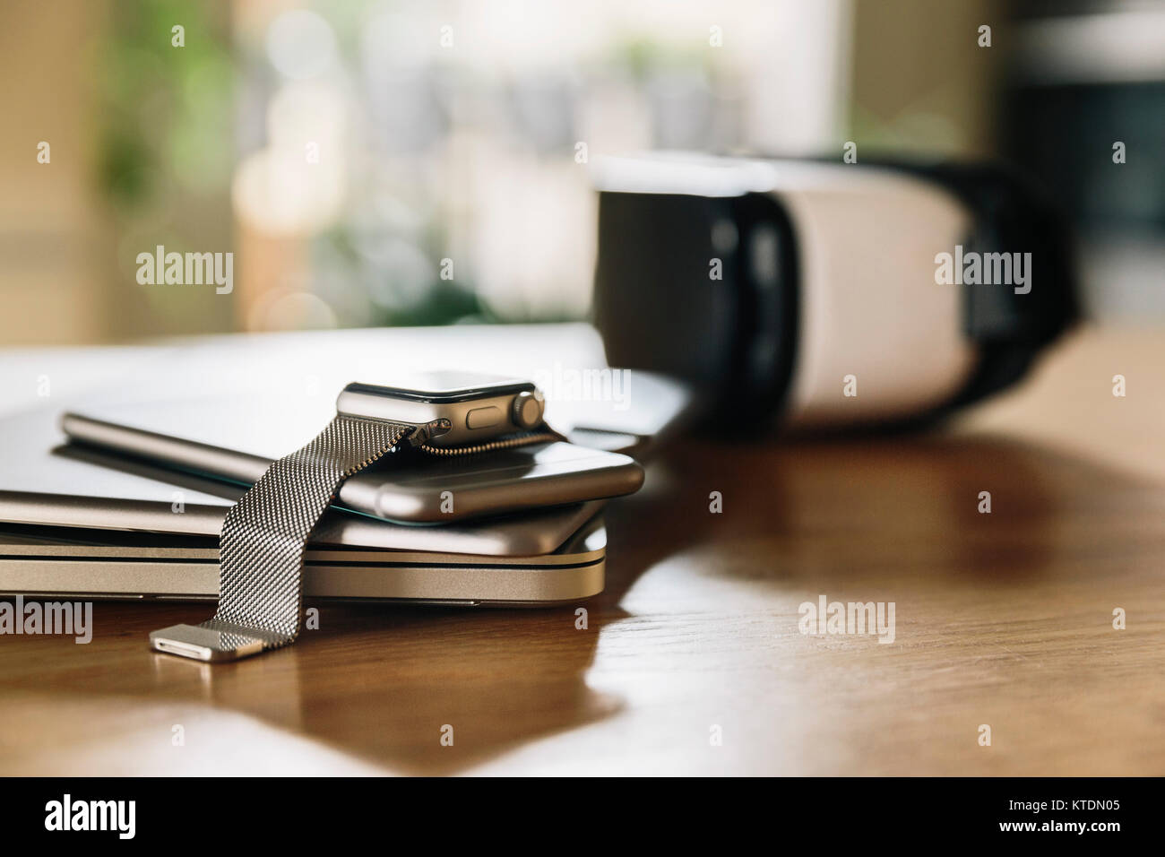 Stack of mobile devices on table top Stock Photo - Alamy
